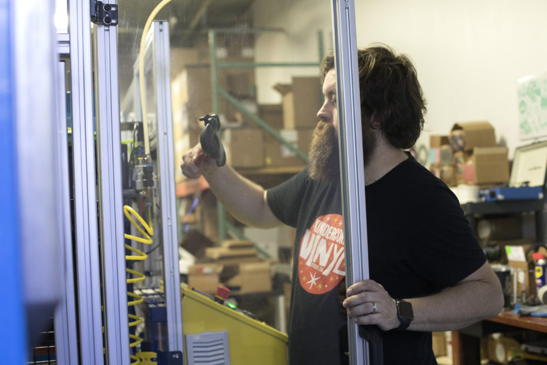 A Triple Dawg pressing vinyl in Athens - UGA Today